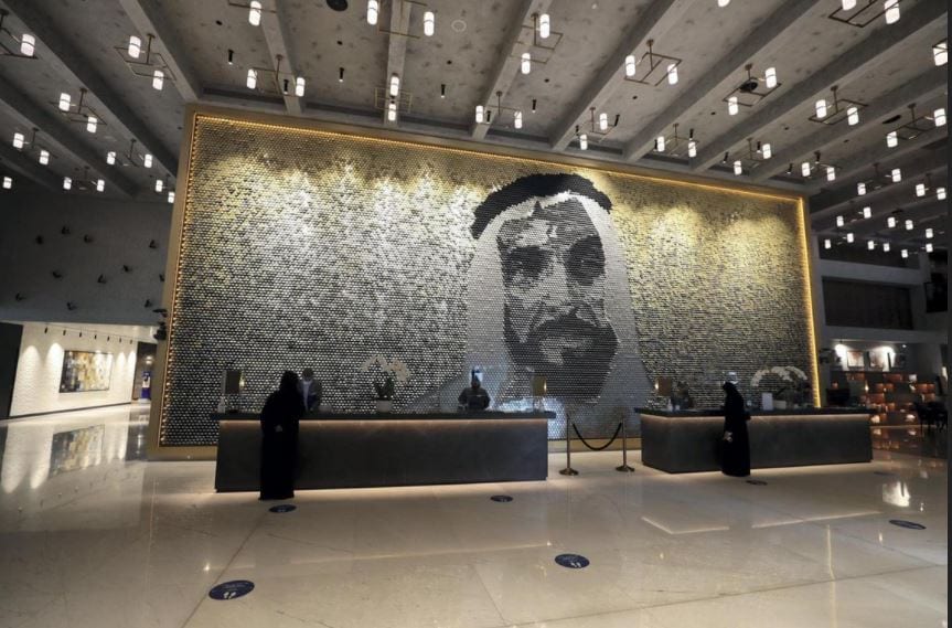 Portrait of Sheikh Zayed made with 30,000 reflective discs - Magzoid ...